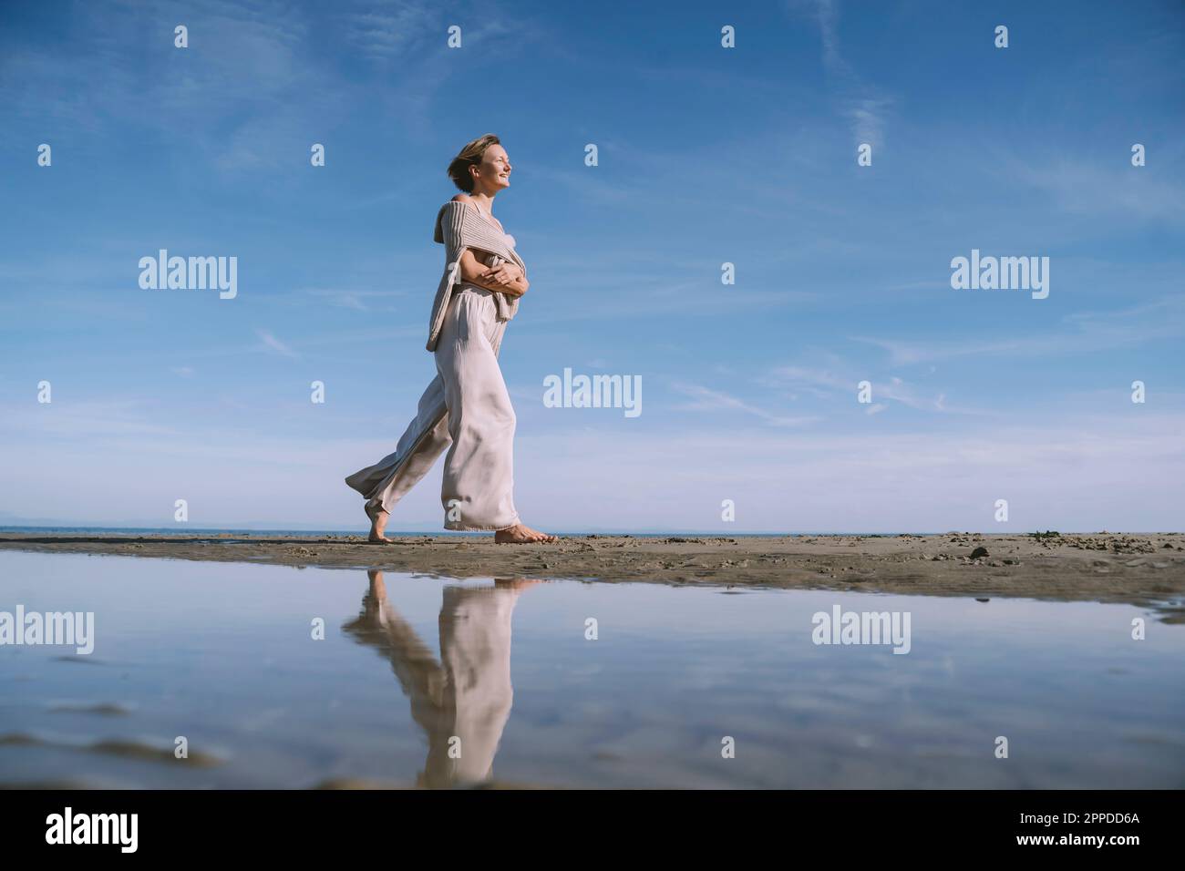 Reflection woman beach hi-res stock photography and images - Alamy