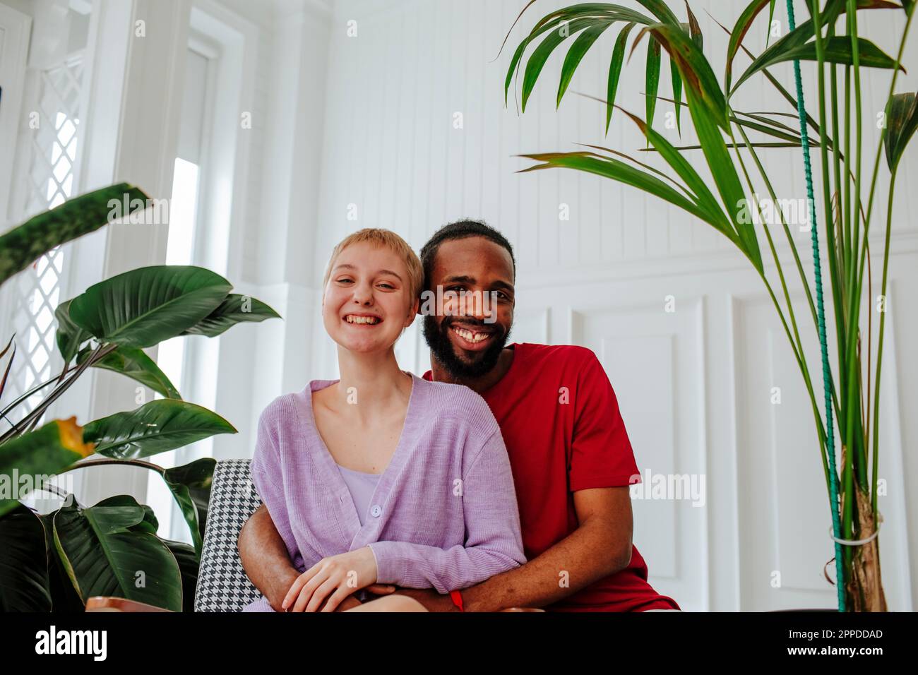 Happy white couple sitting hi-res stock photography and images - Alamy