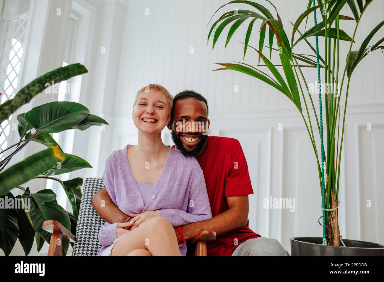 Woman armchair man hi-res stock photography and images - Alamy