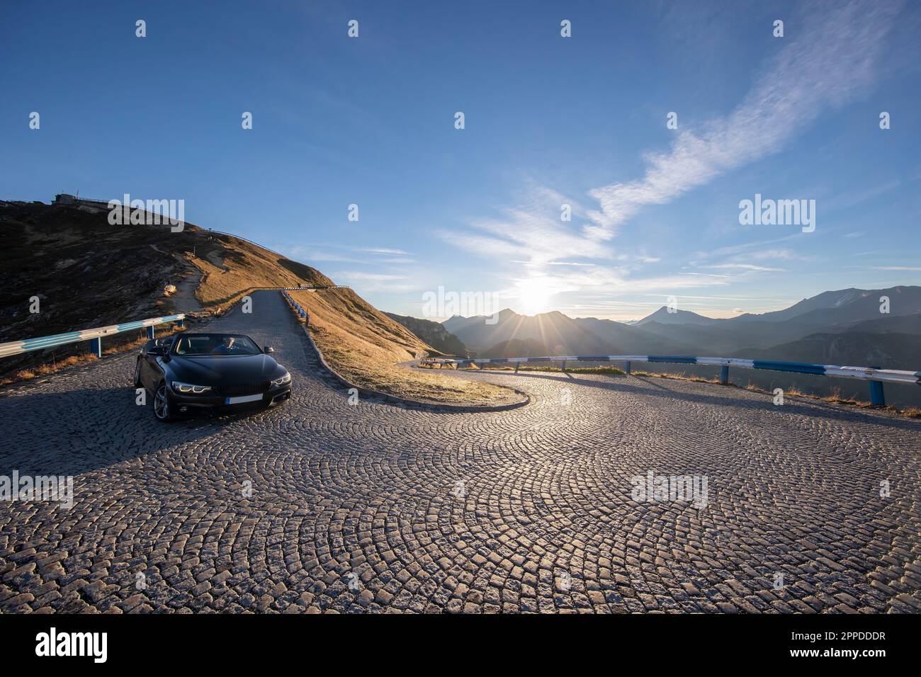 Car Driving Down Winding Road
