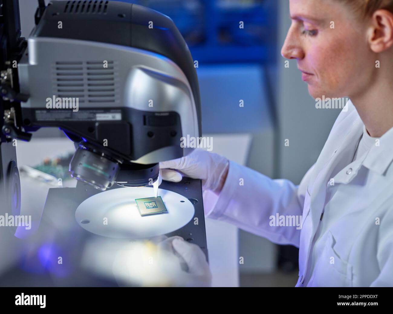Technician working with electric chip at E-Laboratory Stock Photo - Alamy