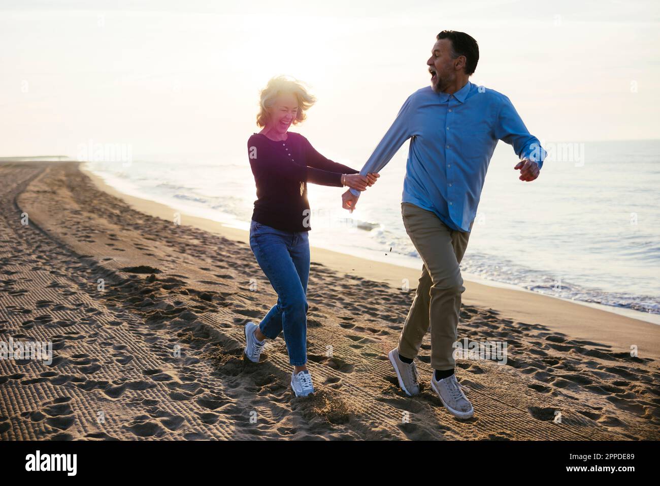 Woman running away from man hi-res stock photography and images - Alamy
