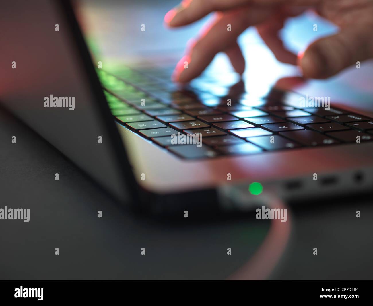 Hands on computer keyboard in dark hi-res stock photography and images - Alamy
