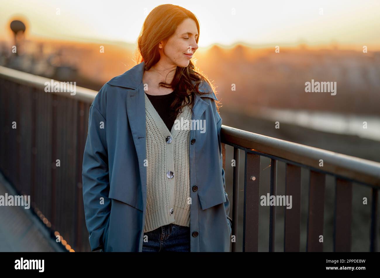 Women standing by bridge railing hi-res stock photography and images ...