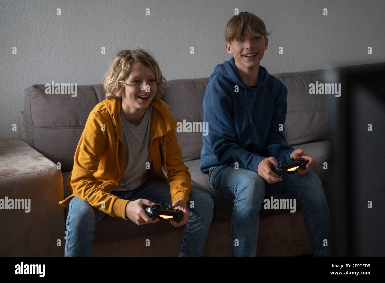Children friends playing game joystick hi-res stock photography and ...