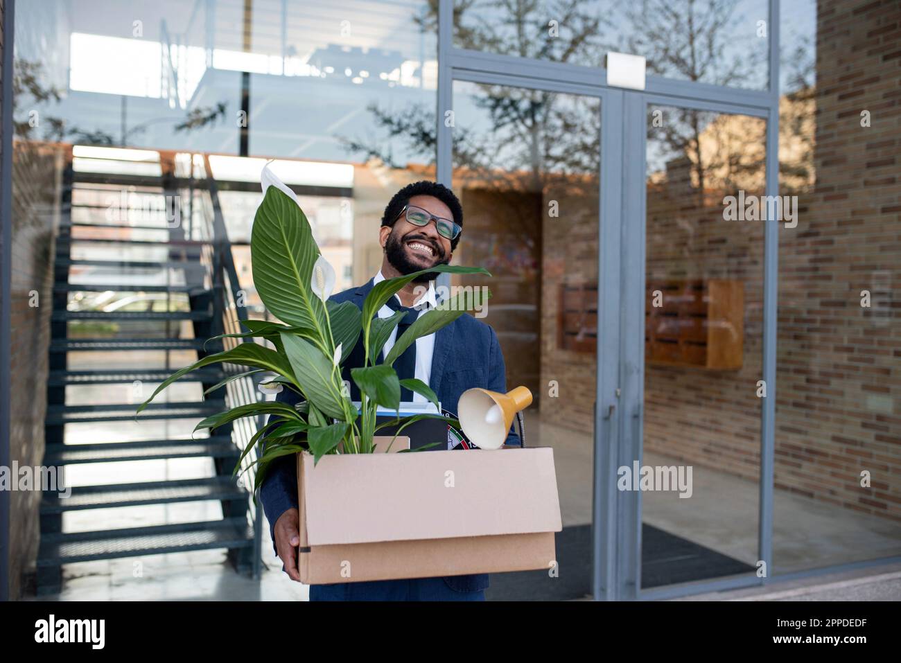 Businessman carrying box supplies hi-res stock photography and images ...