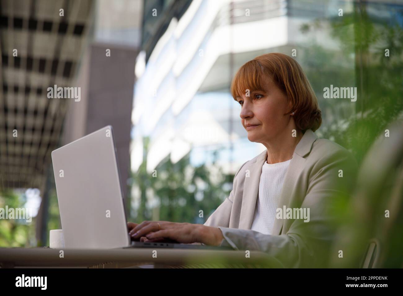 Woman working focused on laptop hi-res stock photography and images - Alamy