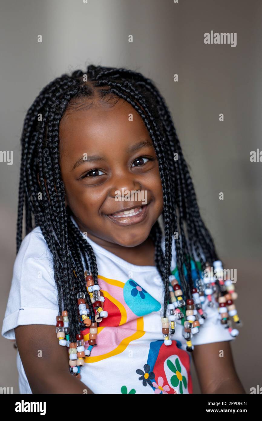 Happy cute girl with braided hair Stock Photo - Alamy