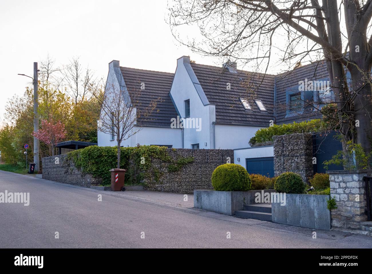 Germany, Bavaria, Road in front of modern suburban houses Stock Photo ...