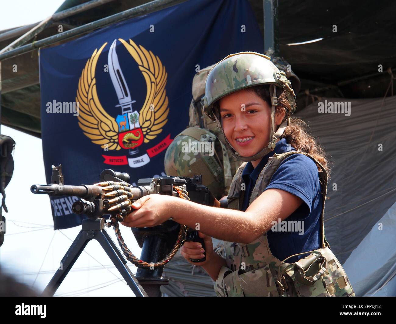 Lima, Peru. 23rd Apr, 2023. A young woman posing with a light machine ...