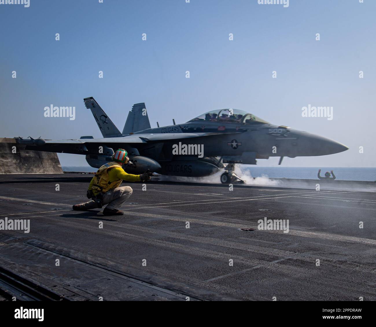 230422-N-MH015-1101 SOUTH CHINA SEA (April 22, 2023) A U.S. Navy Sailor launches an E/A-18G ...