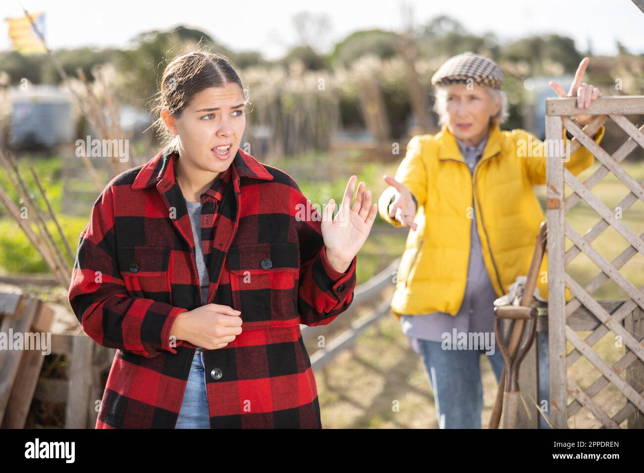 Conflict between female neighbors in country farm Stock Photo - Alamy