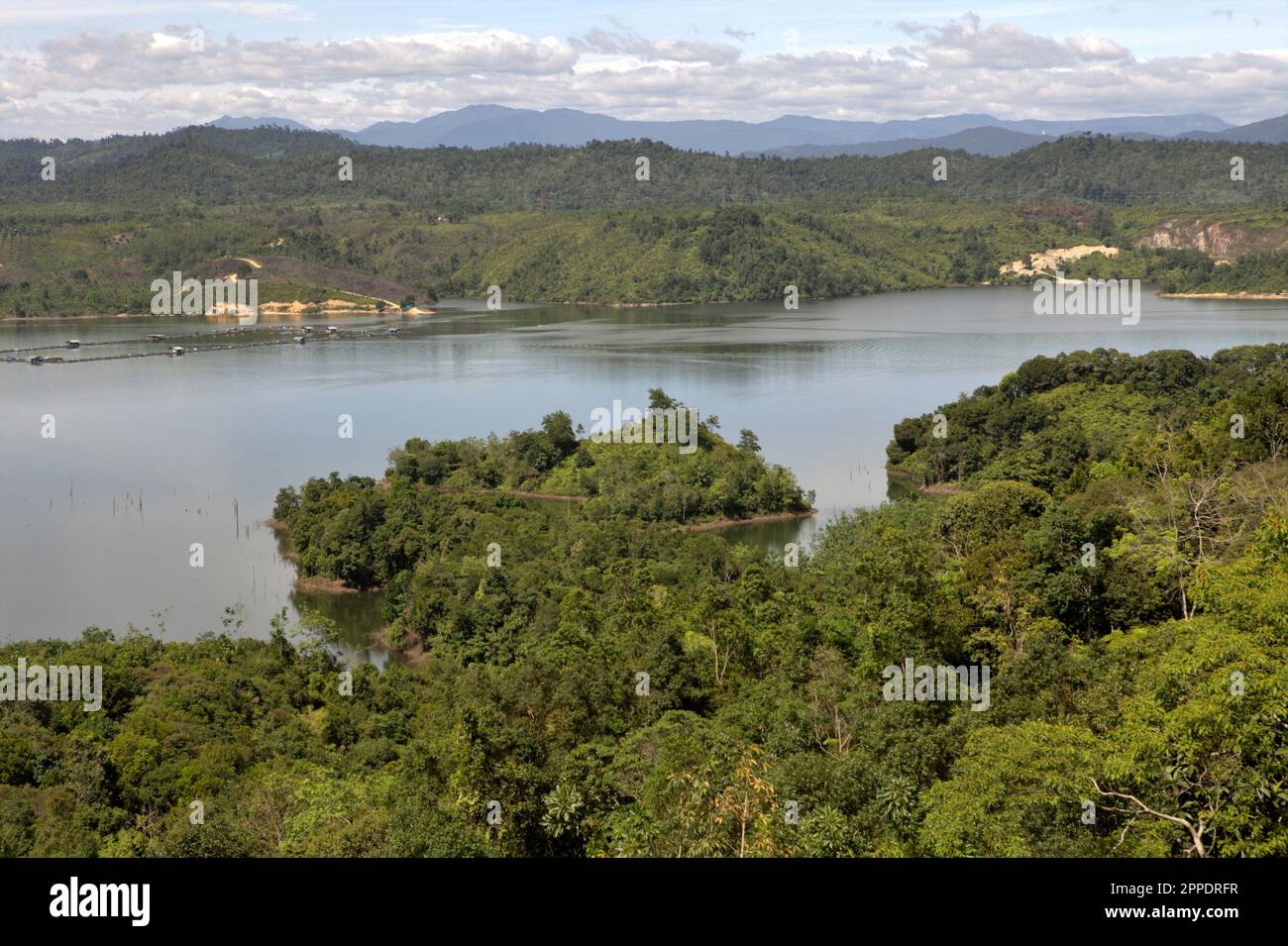Landscape of Kampar River with hills and forest on its banks is ...