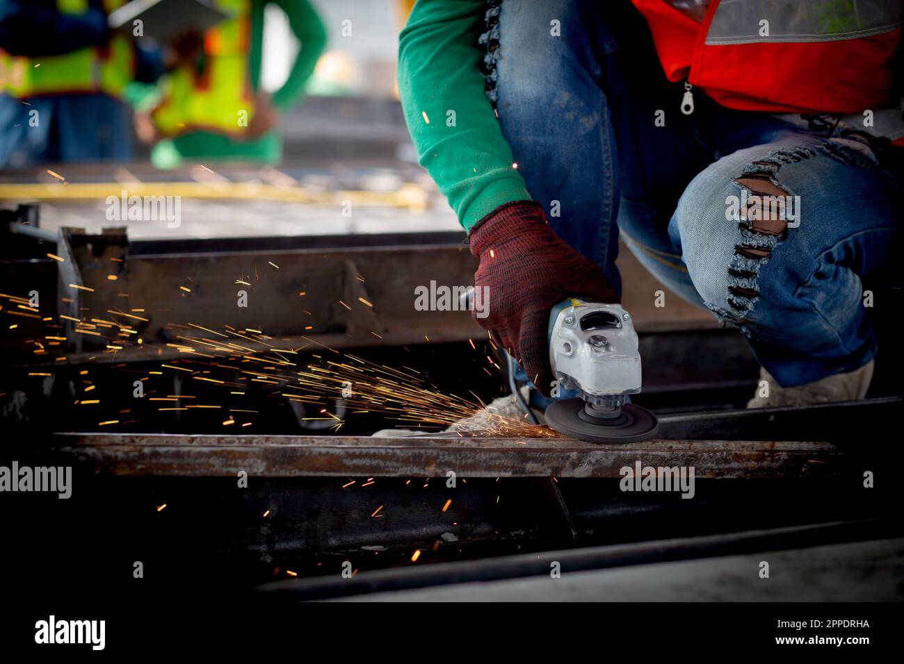 Closeup hands young asian worker using grinder cut iron with hands ...