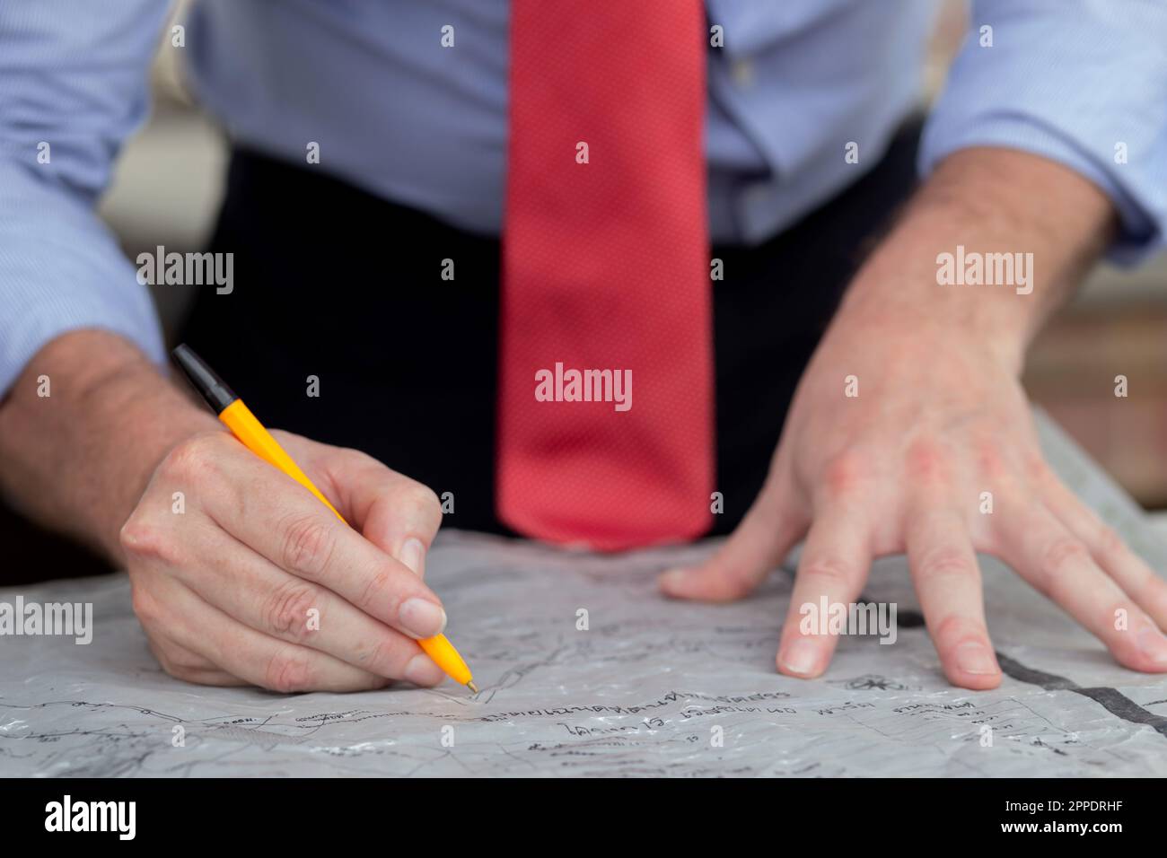 Closeup hands young caucasian architect man working drawing blueprint ...