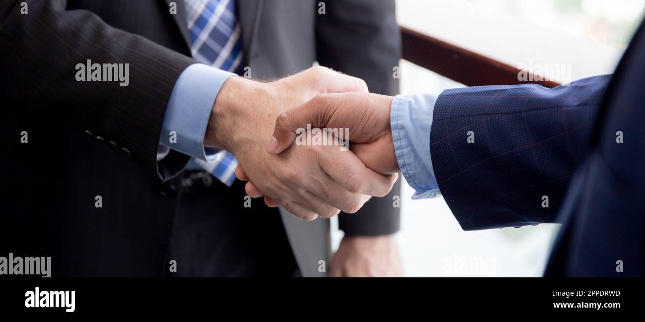Closeup hands of businessman handshake with partner at office, business ...