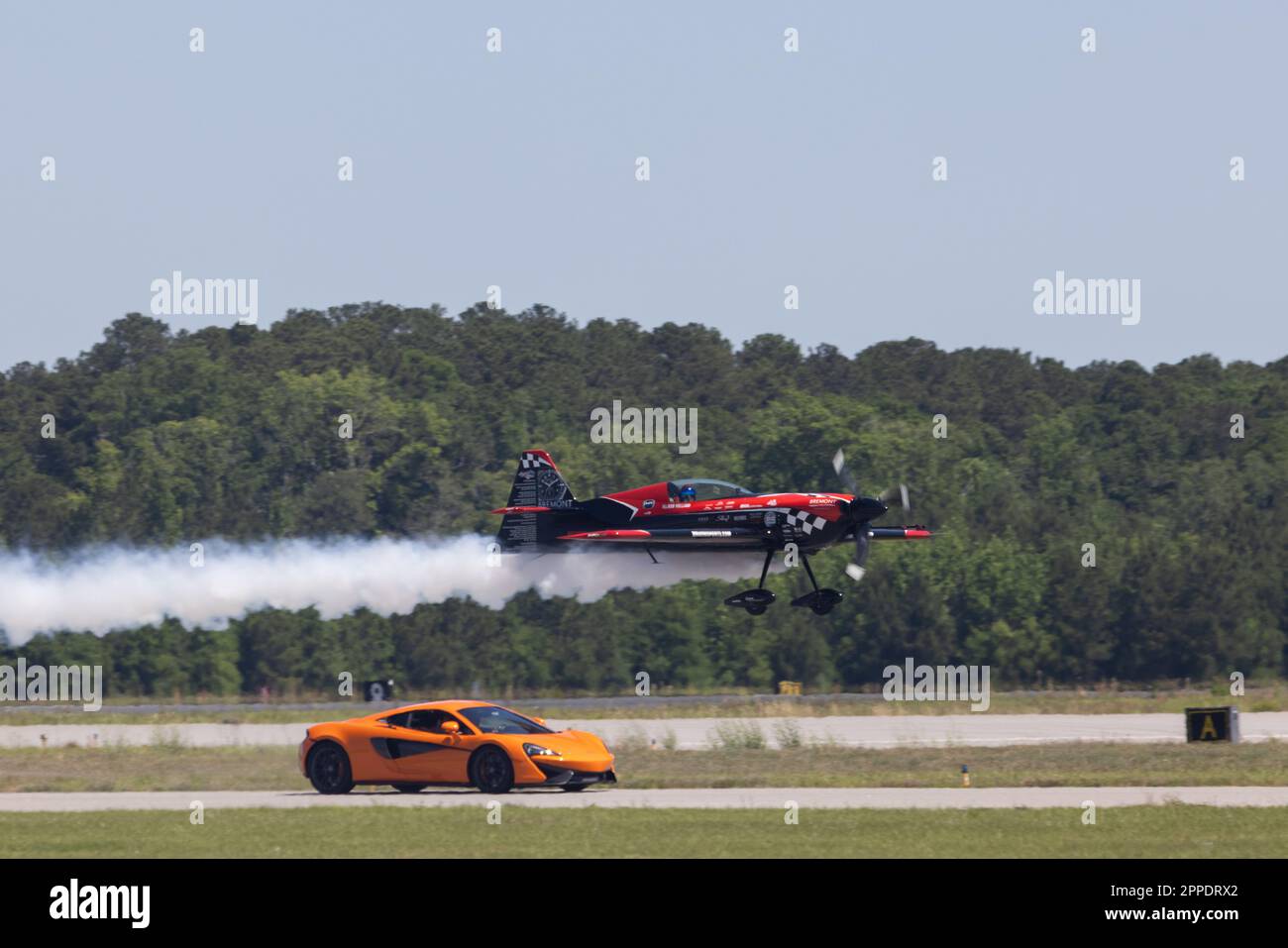 Rob Holland races a member of the Precision Exotics team in a MXS-RH ...