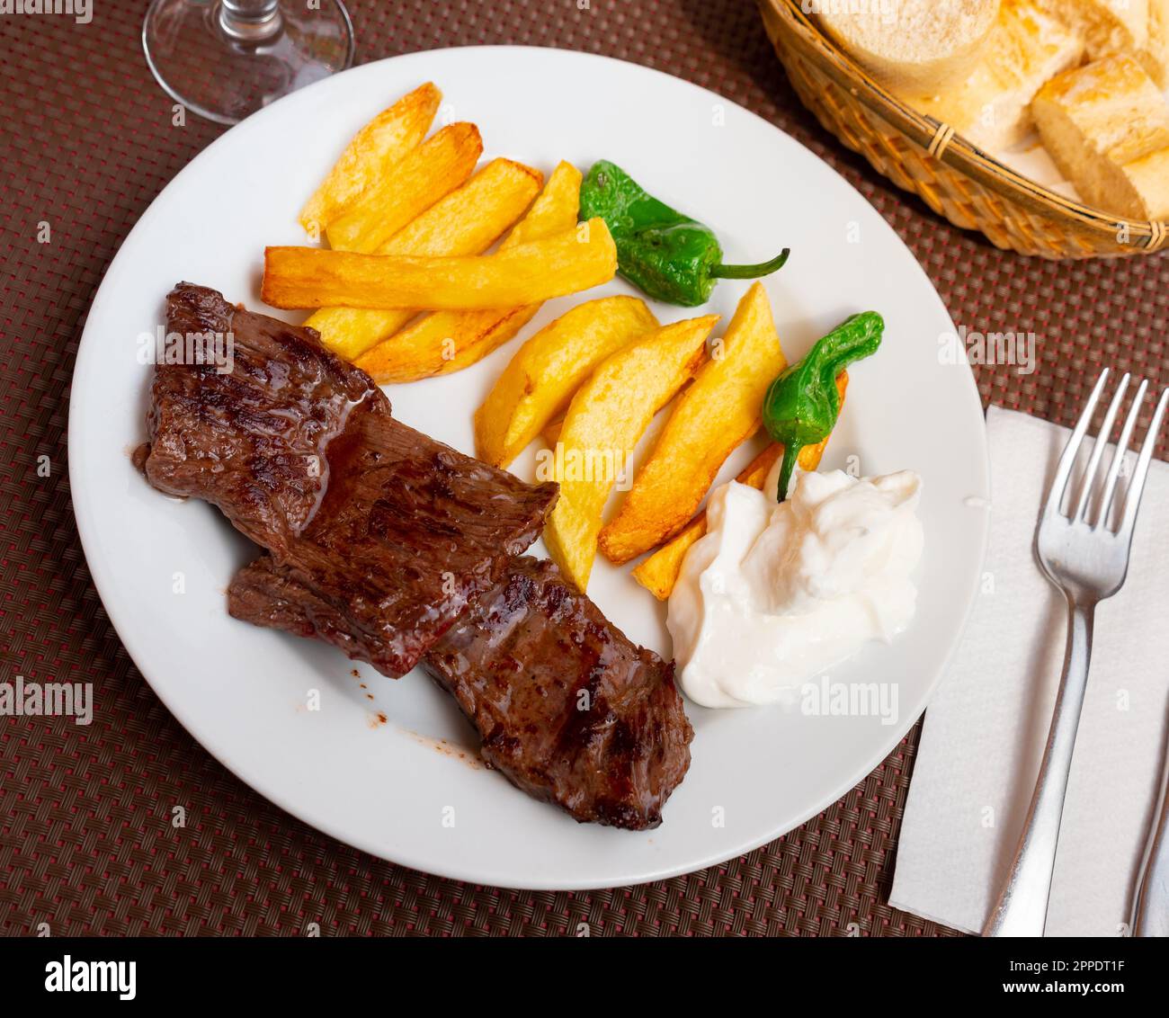 Baked mutton pieces, potato and pepper Stock Photo - Alamy