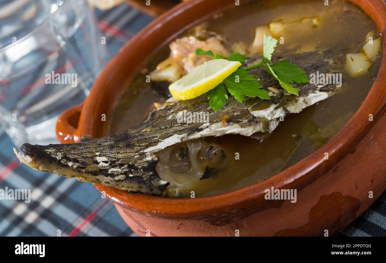 Fish soup with sturgeon in pottery Stock Photo - Alamy