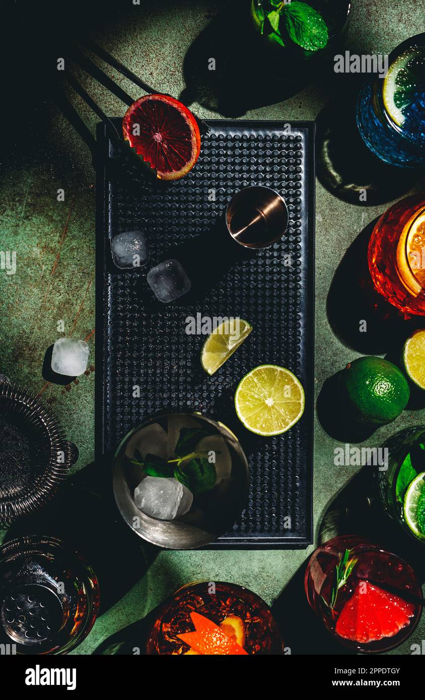Cocktails set on rusty green bar counter, top view. Mixology concept ...