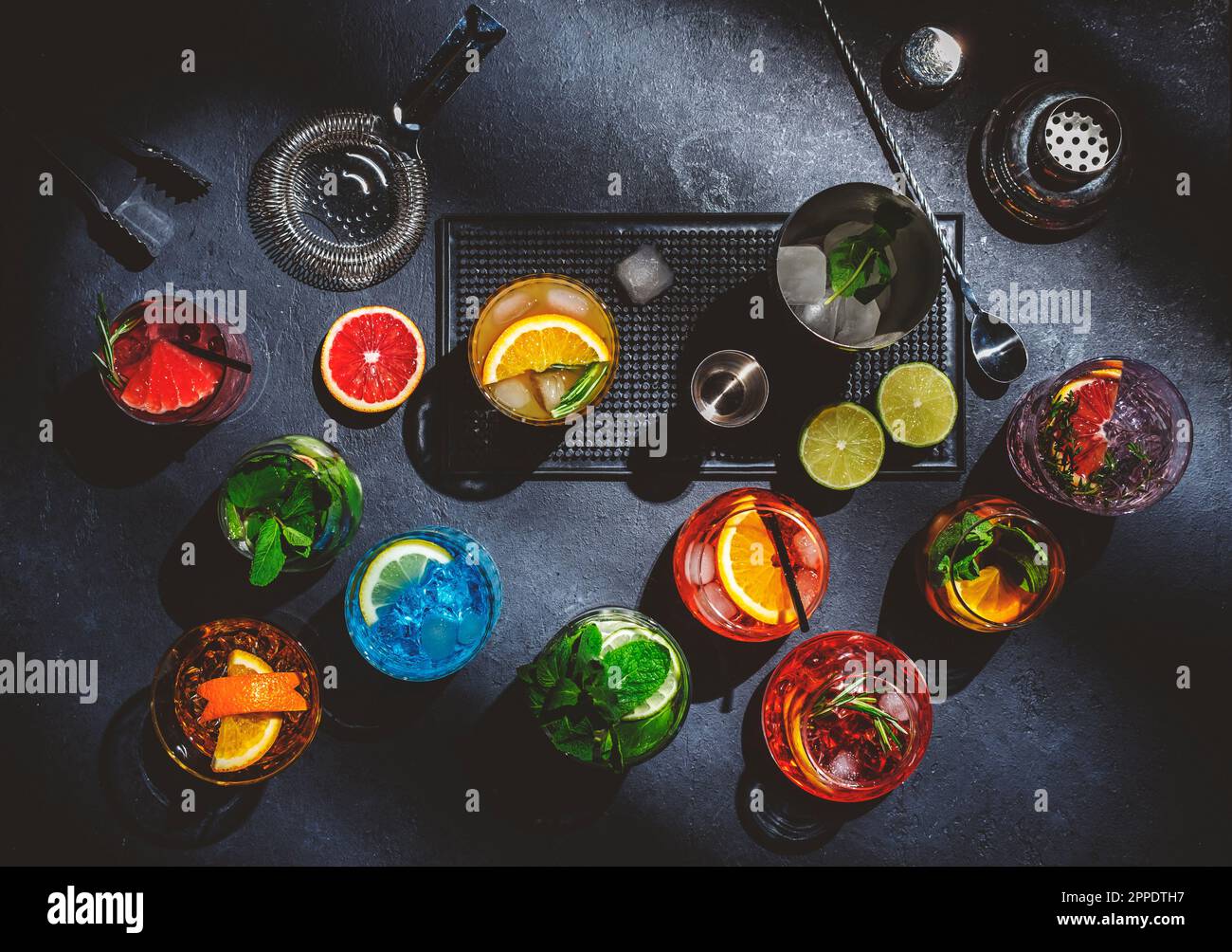 Cocktails set on black bar counter, top view. Mixology concept ...