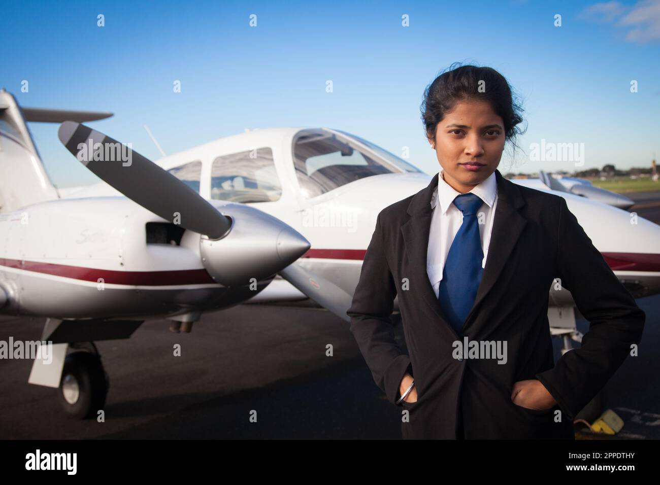 Female Pilot Standing in Front of Her Aircraft Stock Photo - Alamy