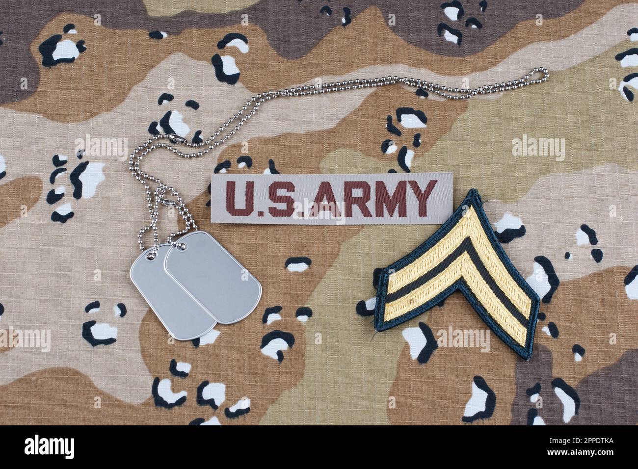 US ARMY branch tape and corporal rank patch with dog tags on desert ...