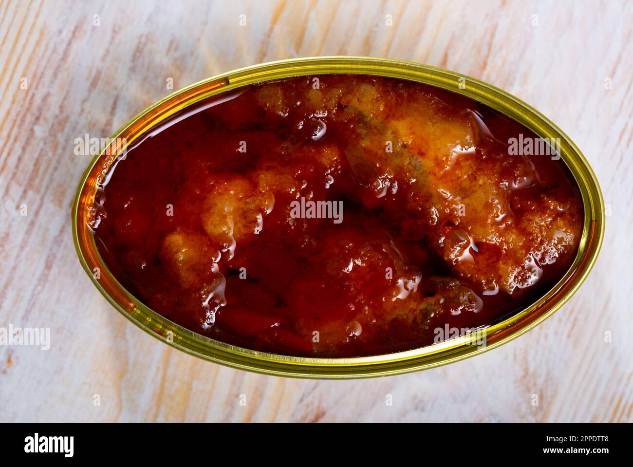 Pickled cod in tomato sauce in open tin can, nobody Stock Photo - Alamy