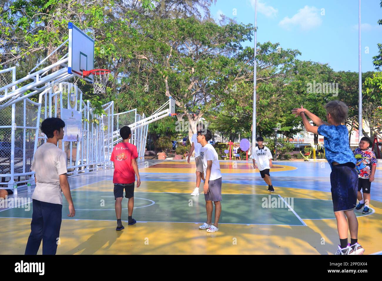 Teenage boys play netball at Sri Muang park, Suan Si Mueang, central ...