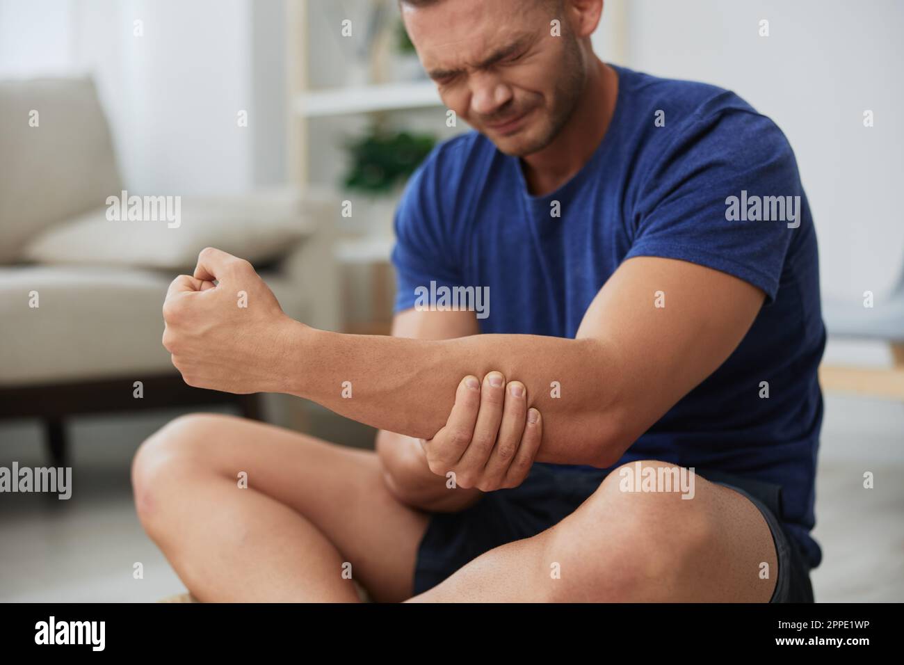 Man athlete pain and injury back arm and leg at home, sports injury ...