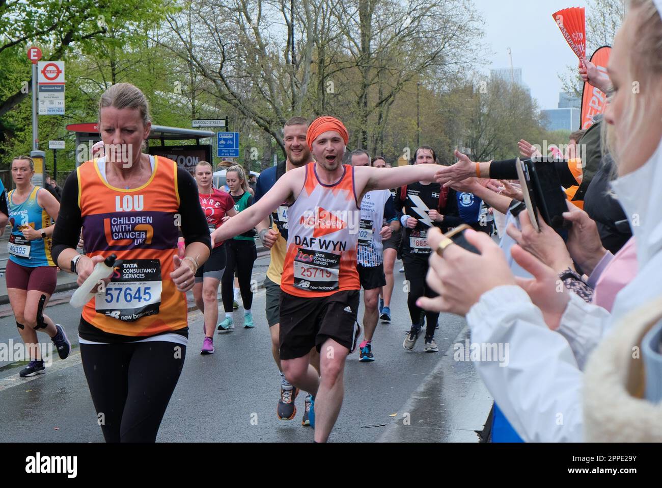 London, UK. 23rd April, 2023. Runners proceed along Jamaica Road, the ...