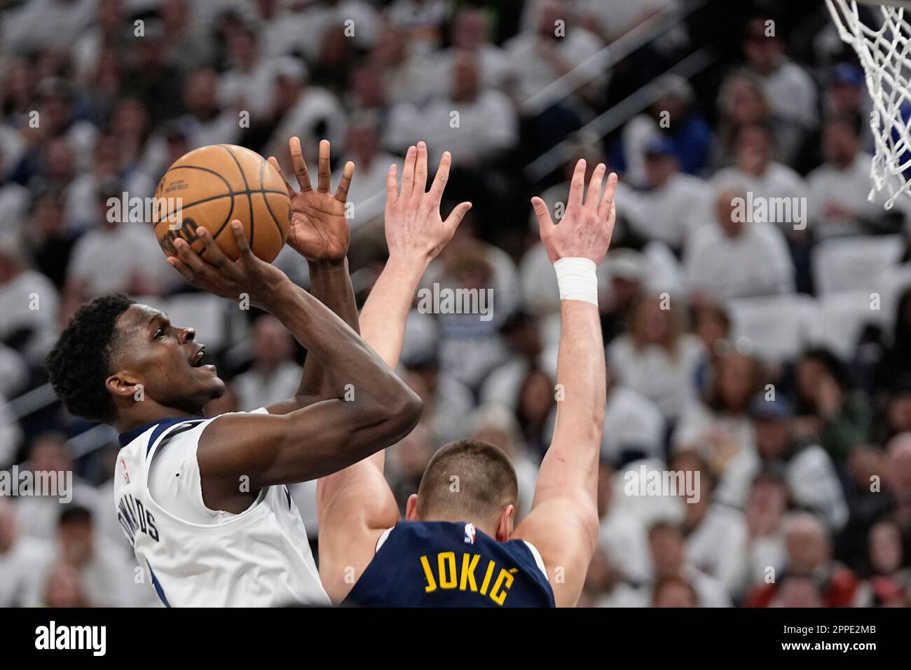 Minnesota Timberwolves guard Anthony Edwards shoots while defended by ...