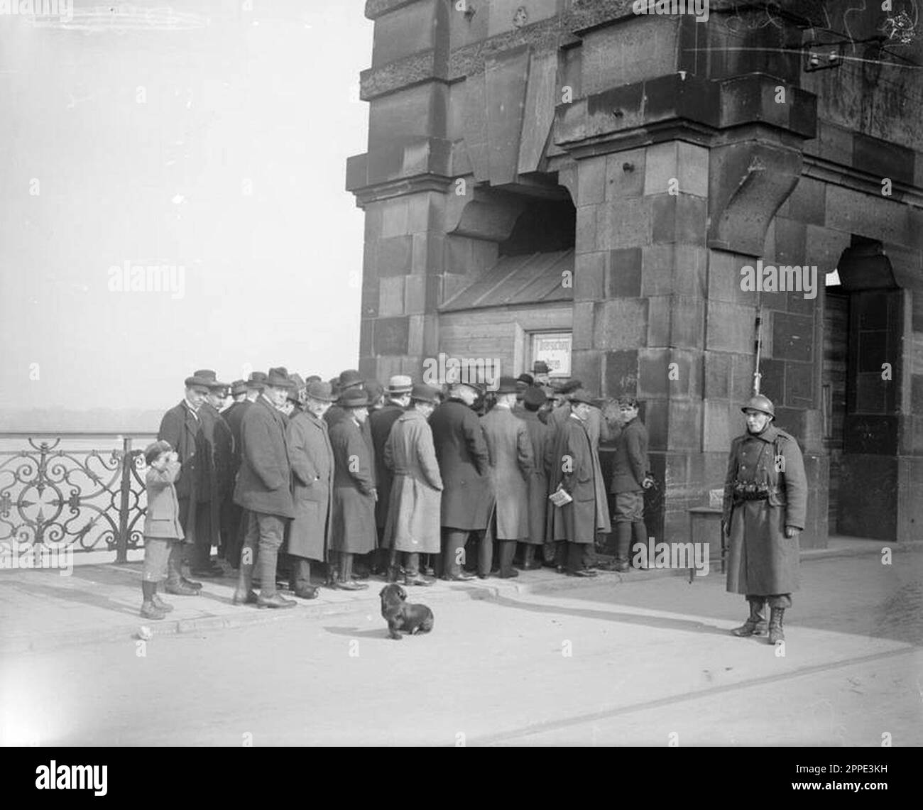 German civilians waiting to be searched for firearms by Belgian ...