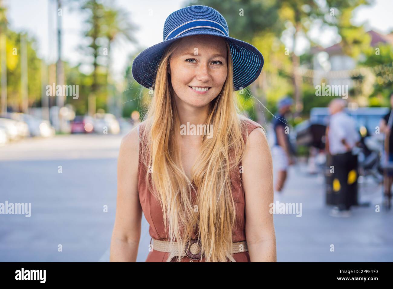 Happy woman tourist on background of old street of Antalya. female ...