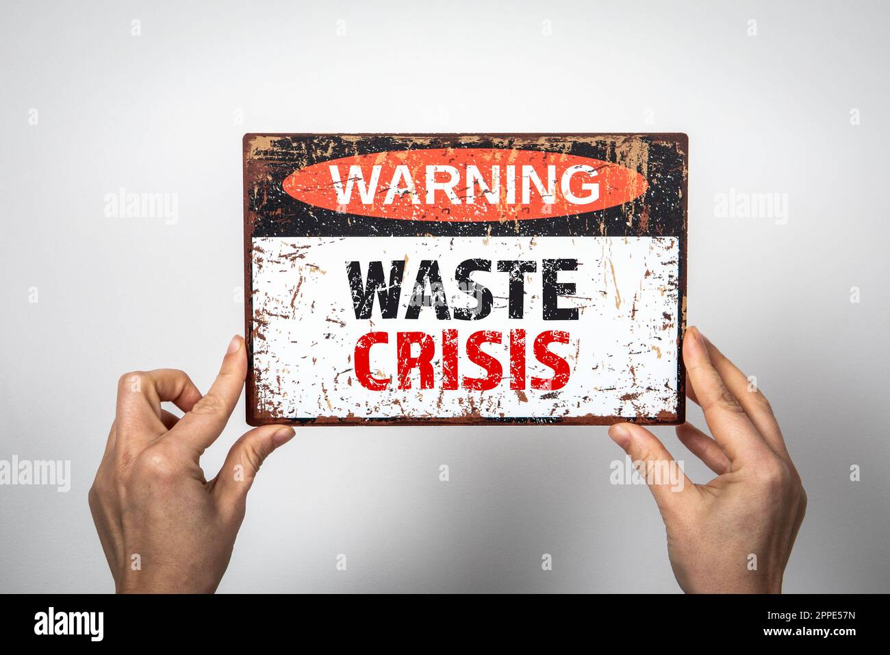 Waste Crisis concept. Warning sign with text on a white background ...
