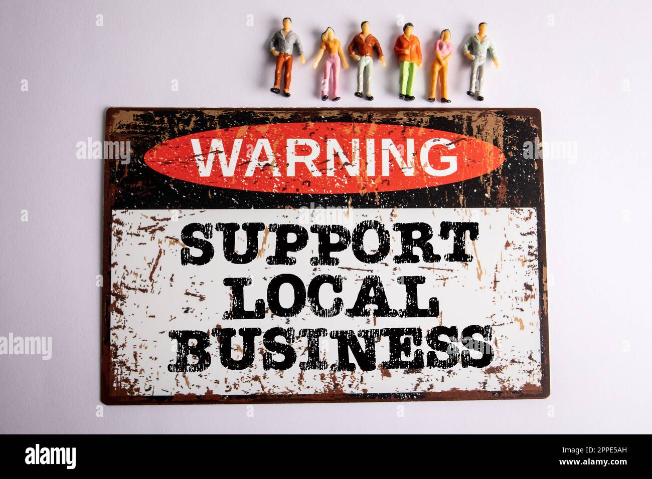 Support local business. Warning sign with text and miniature human ...