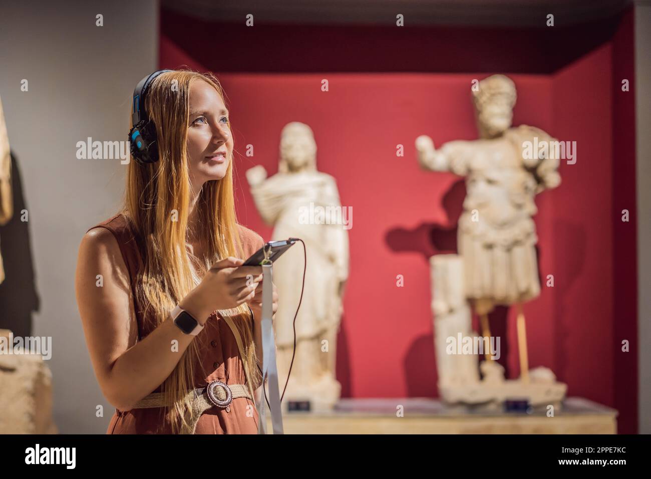 Visitor listening audio guide hi-res stock photography and images - Alamy