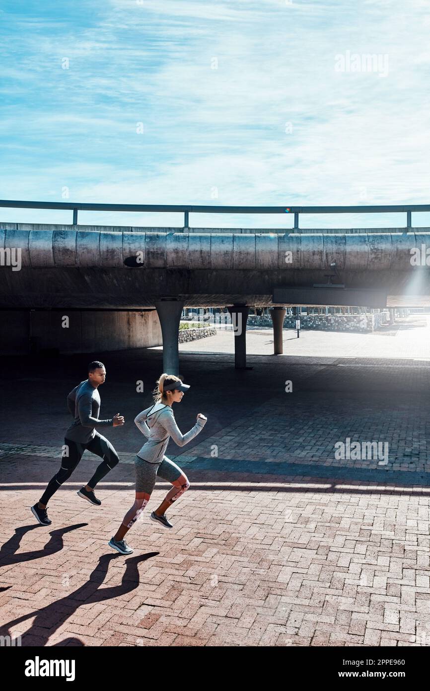 Staying in top form together. Full length shot of two young and ...