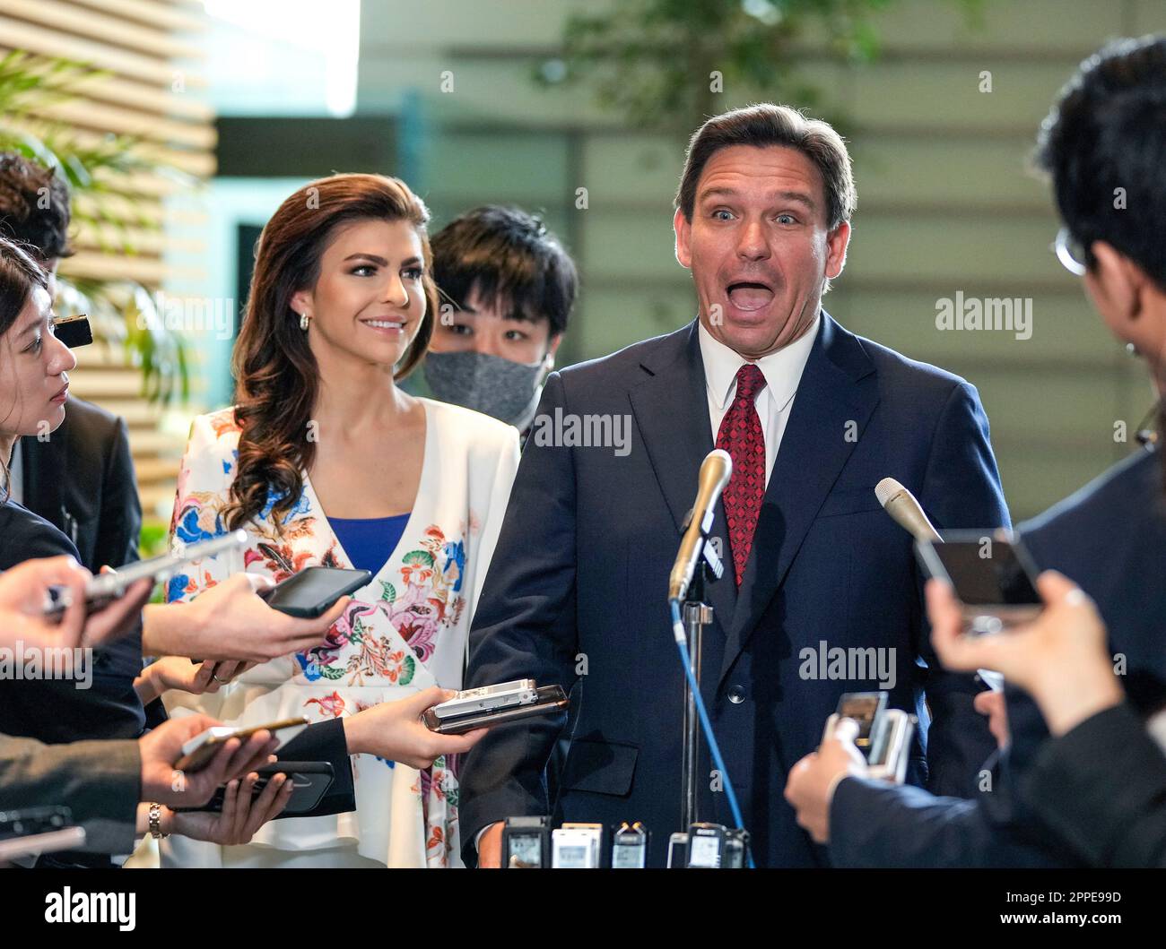 Florida Gov. Ron DeSantis, right, shows his surprise to journalists as ...