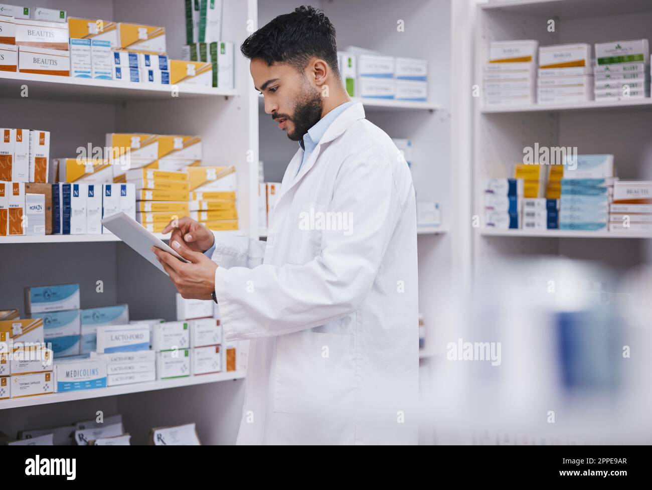 Doctor pharmacist checking information hi-res stock photography and ...