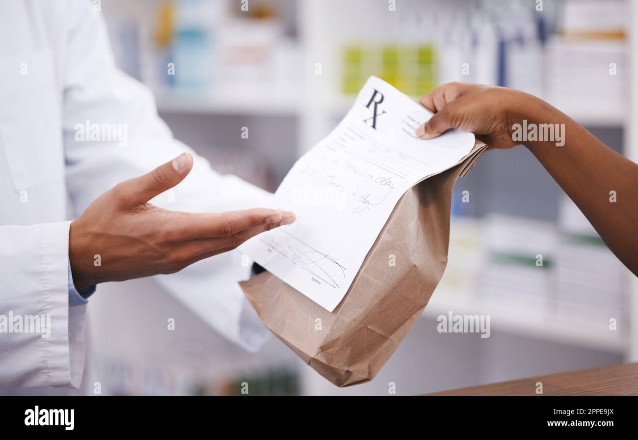 Pharmacy, medicine or pharmacist hands a bag in drugstore with ...