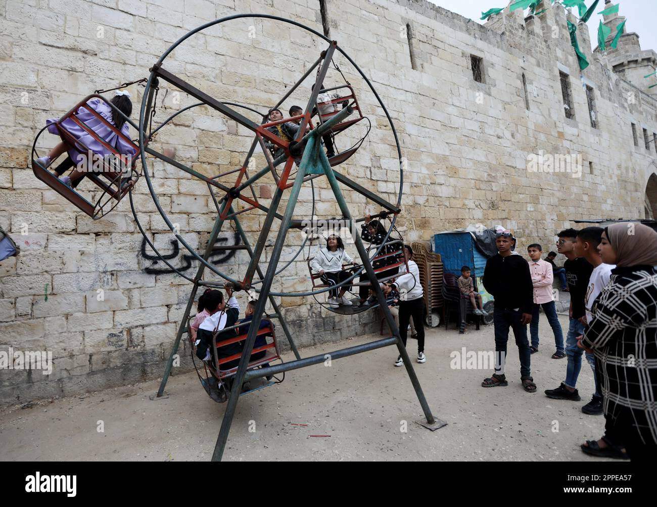 Gaza, Palestine. 23rd Apr, 2023. Palestinian children ride on Ferris ...