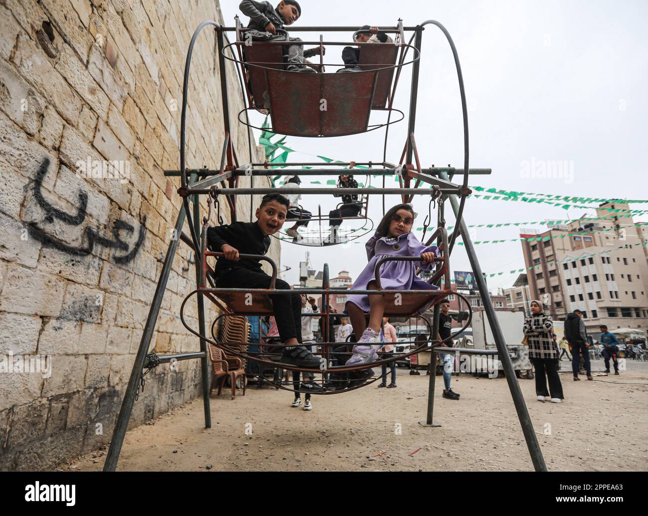 Gaza, Palestine. 23rd Apr, 2023. Palestinian children ride on Ferris ...