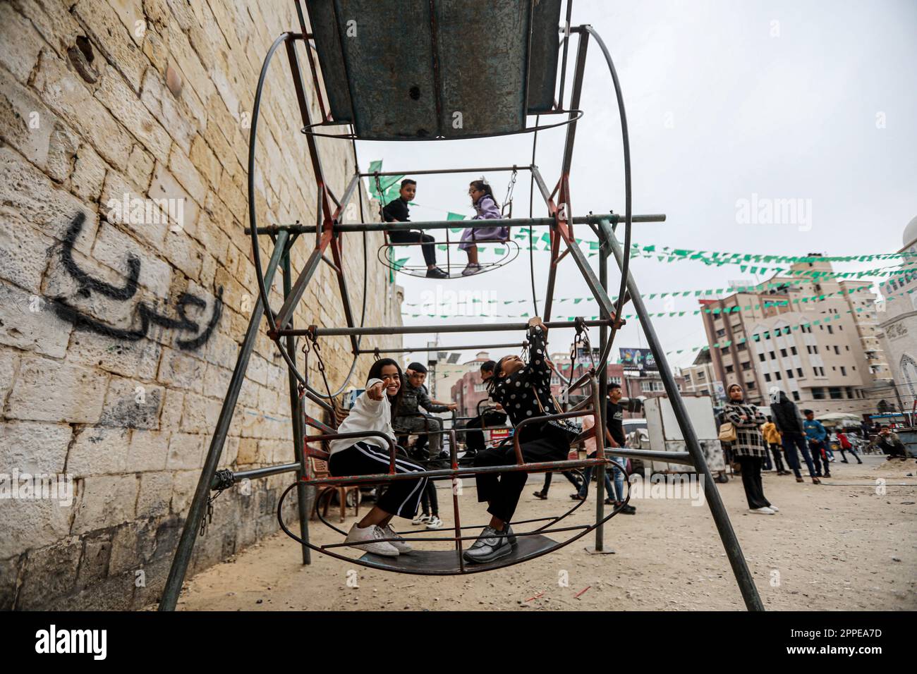Gaza, Palestine. 23rd Apr, 2023. Palestinian children ride on Ferris ...