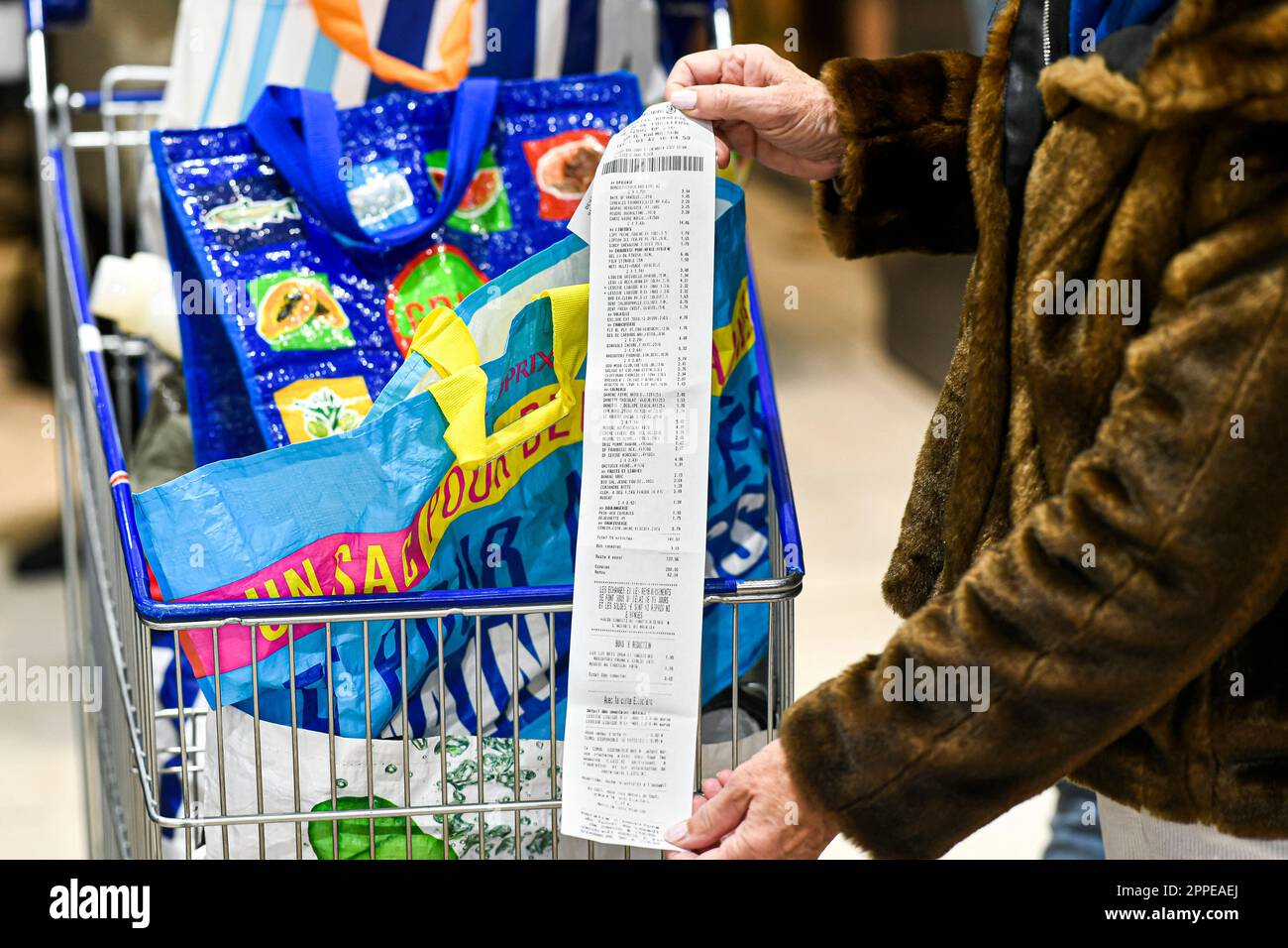 Illustration shows a customer checking his cashier's paper receipt as ...