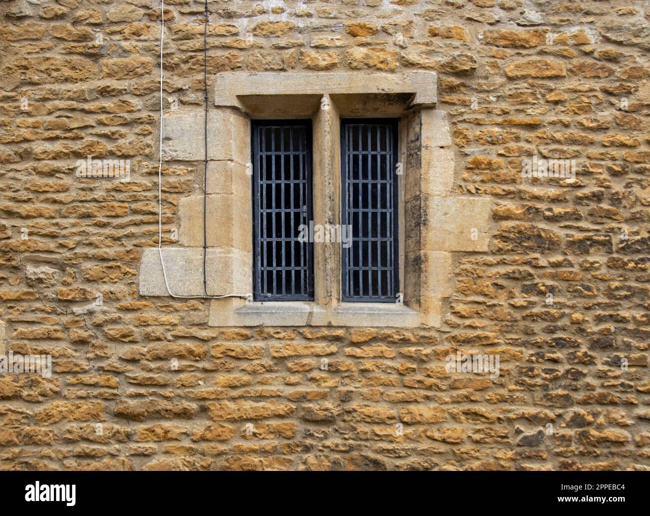 Narrow windows set in a thick stone wall in Peterborough ...