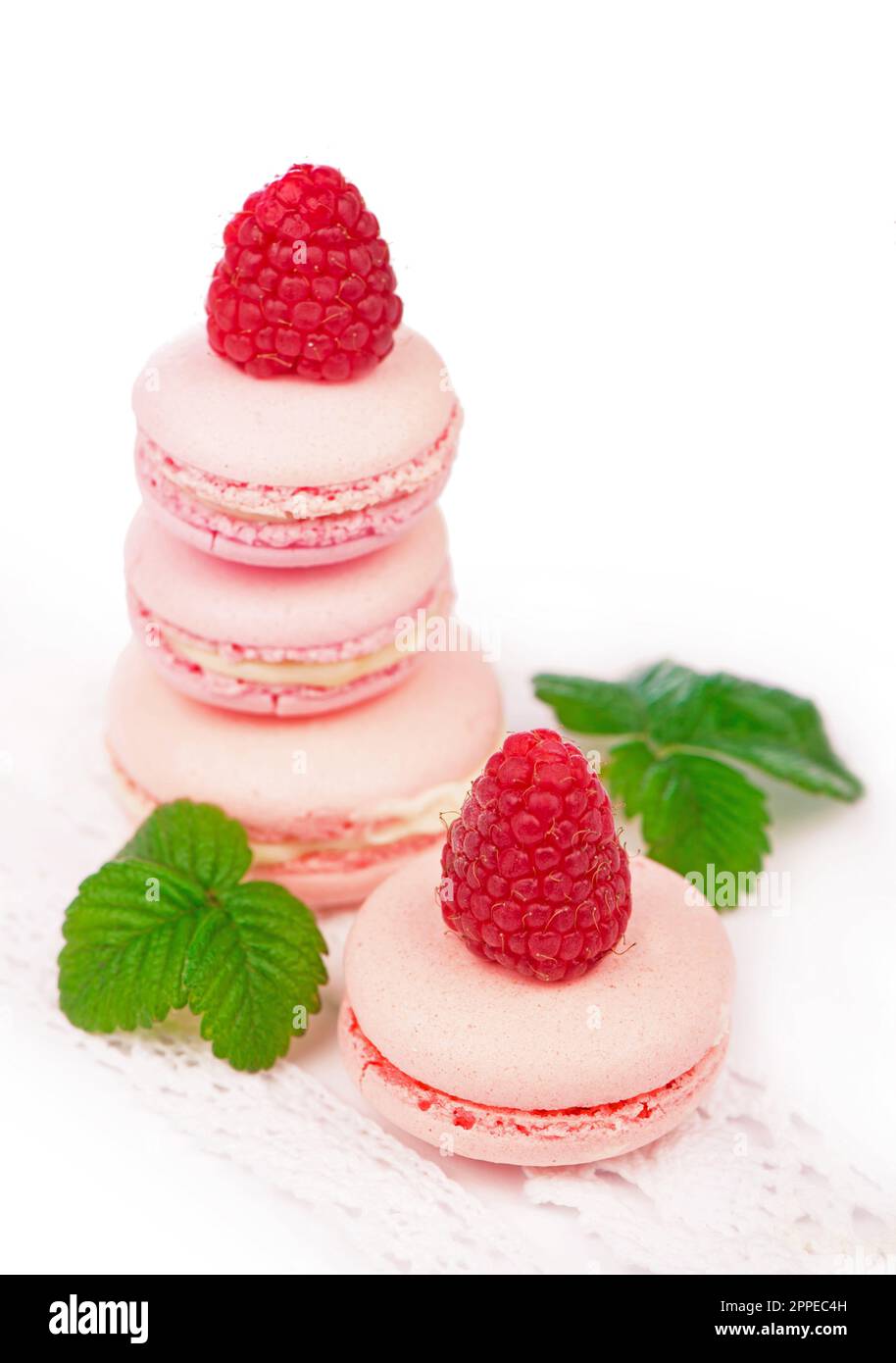Pink raspberry macaron cookies. Isolated on white background Stock Photo - Alamy