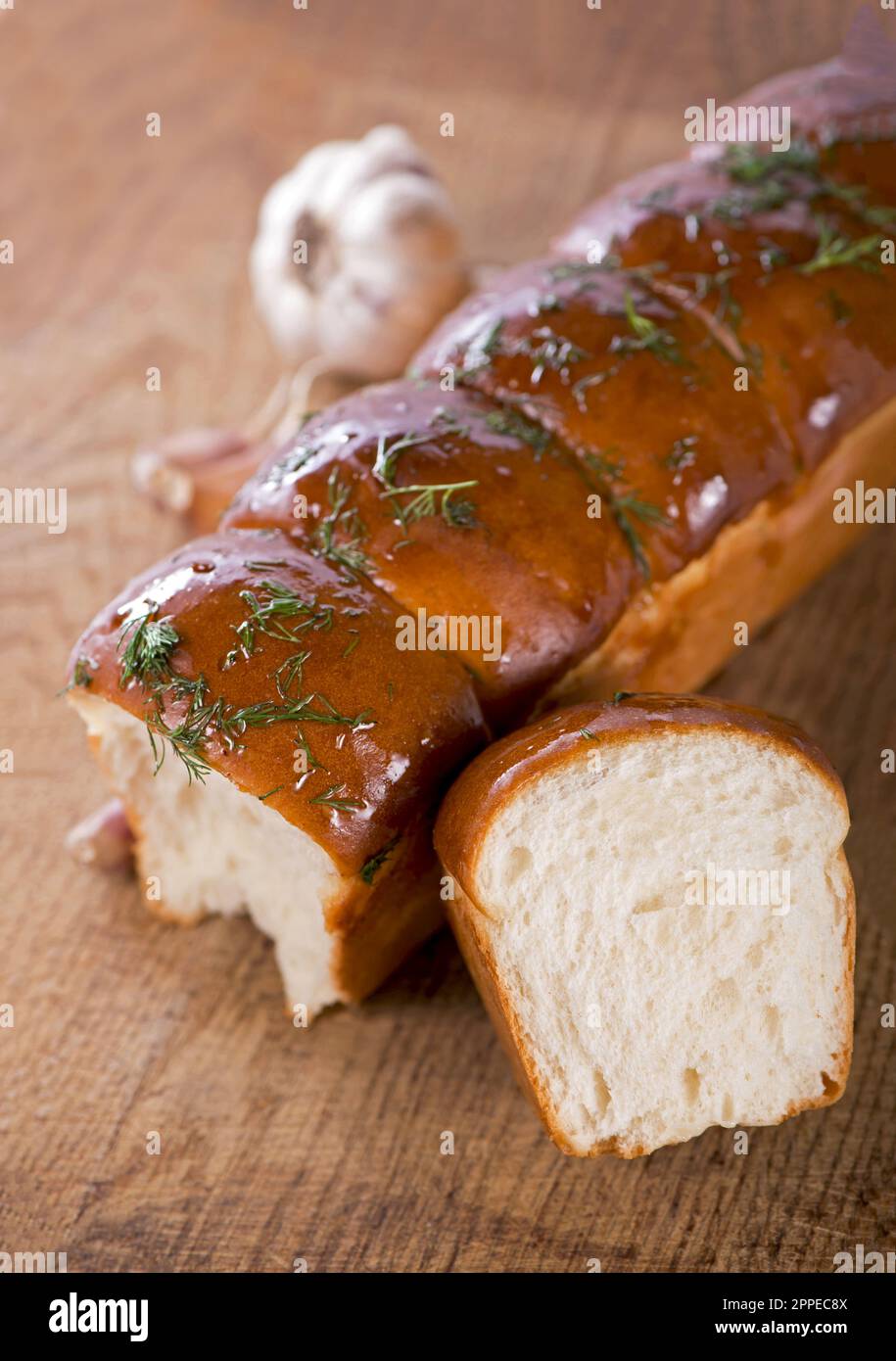 tasty bread with garlic lying on white background Stock Photo - Alamy