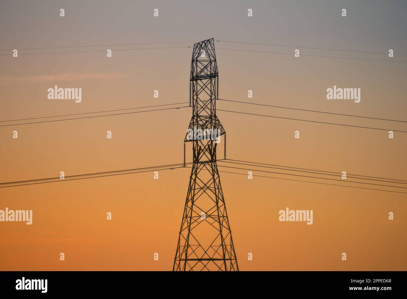 Electrical Pylon and Sunset Gradient Stock Photo - Alamy