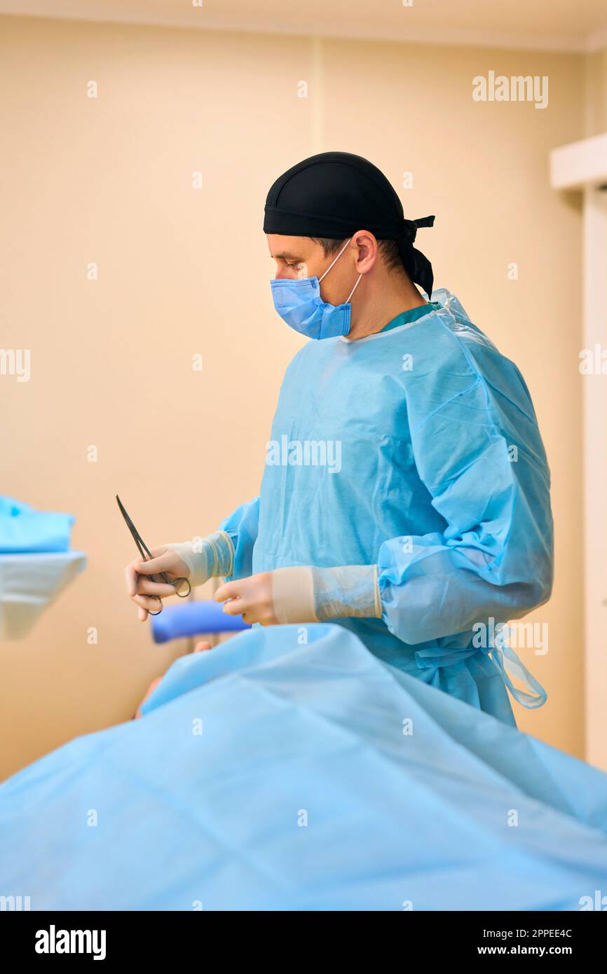 plastic surgeon operates on a patient in the operating room Stock Photo ...